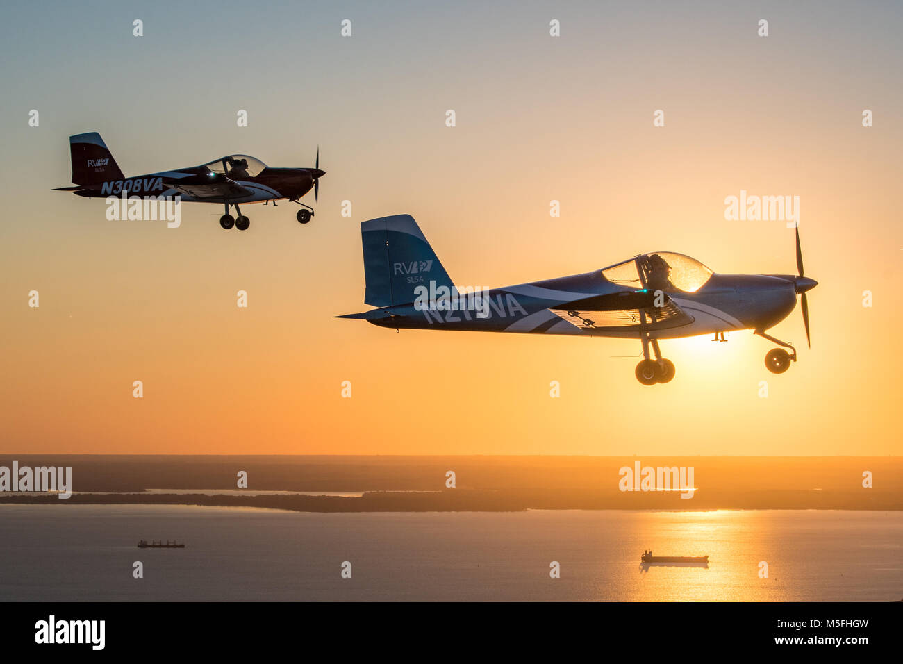 Two Vans RV-12 light sport aircrafts fly in formation together with the ...