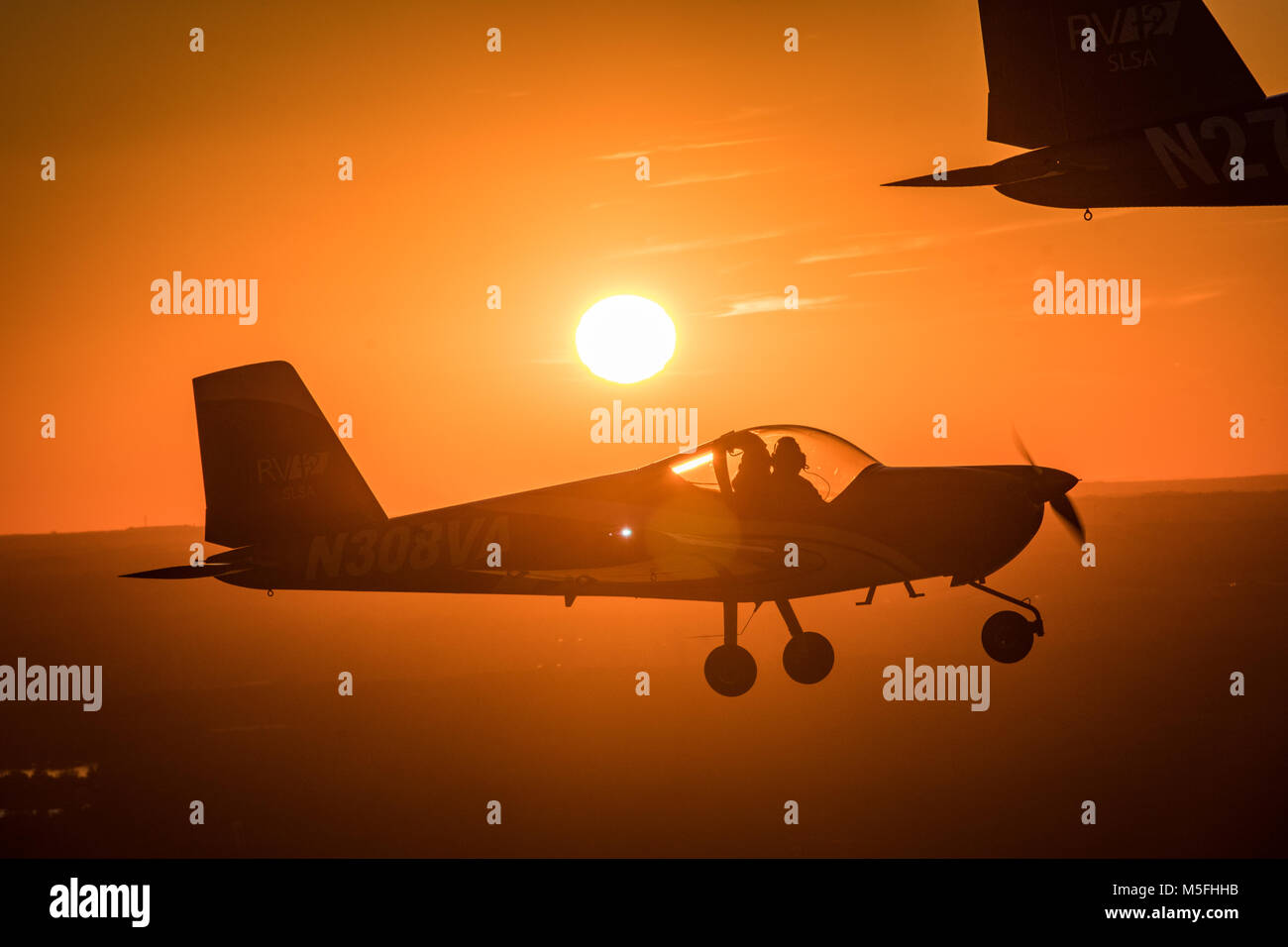 Two Vans RV-12 light sport aircrafts fly in formation together with the ...