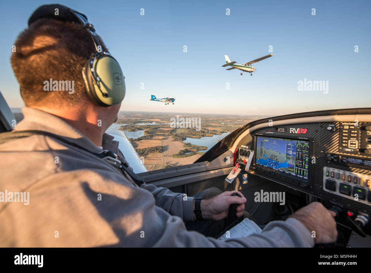 Inside cockpit of Vans RV-12 light sport aircraft with male pilot ...