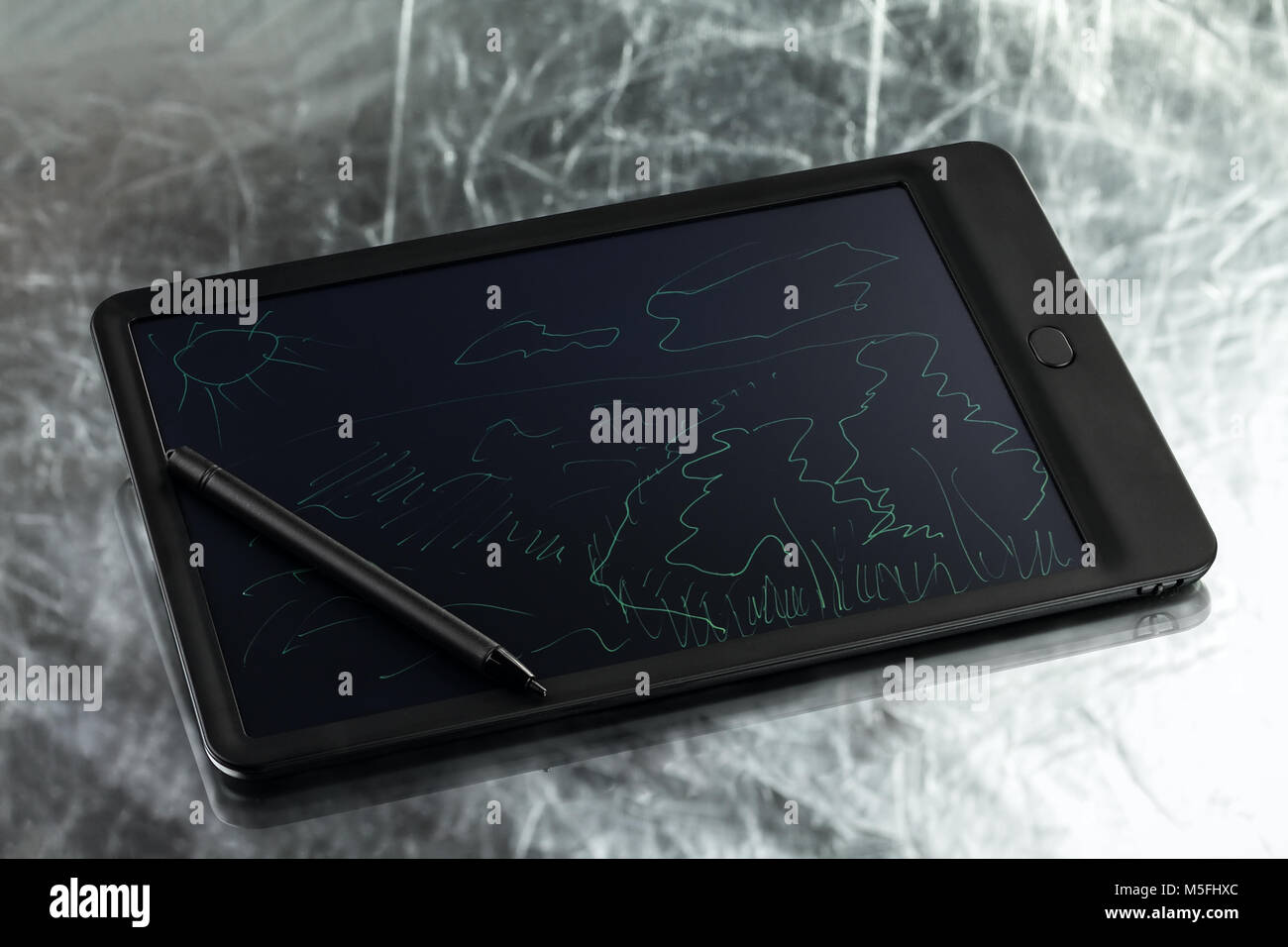 graphic tablet with pen on silvery background Stock Photo - Alamy