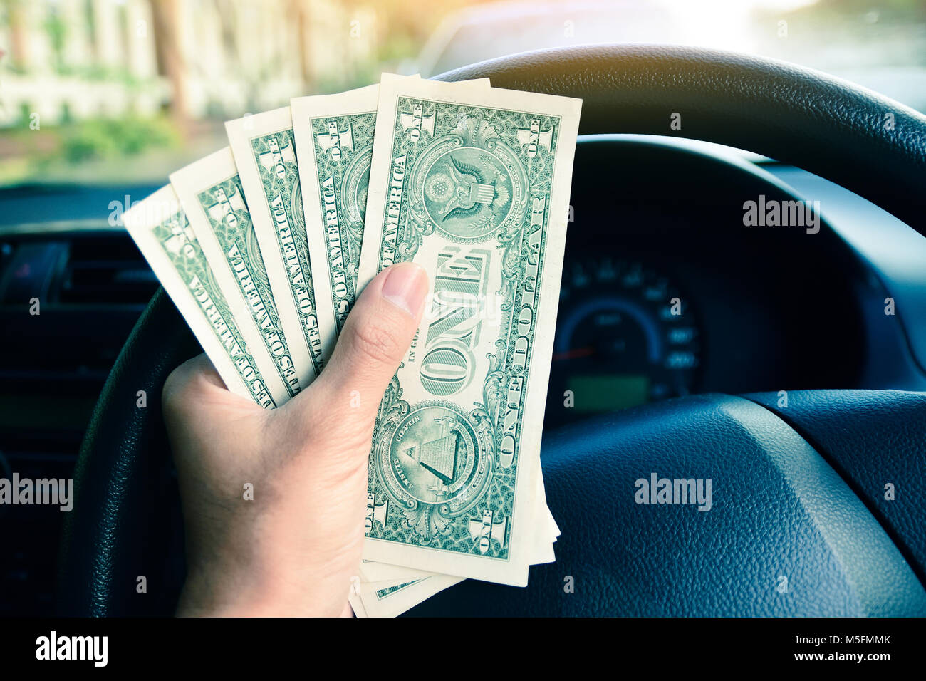 Hundred dollar bill in car hi-res stock photography and images - Alamy