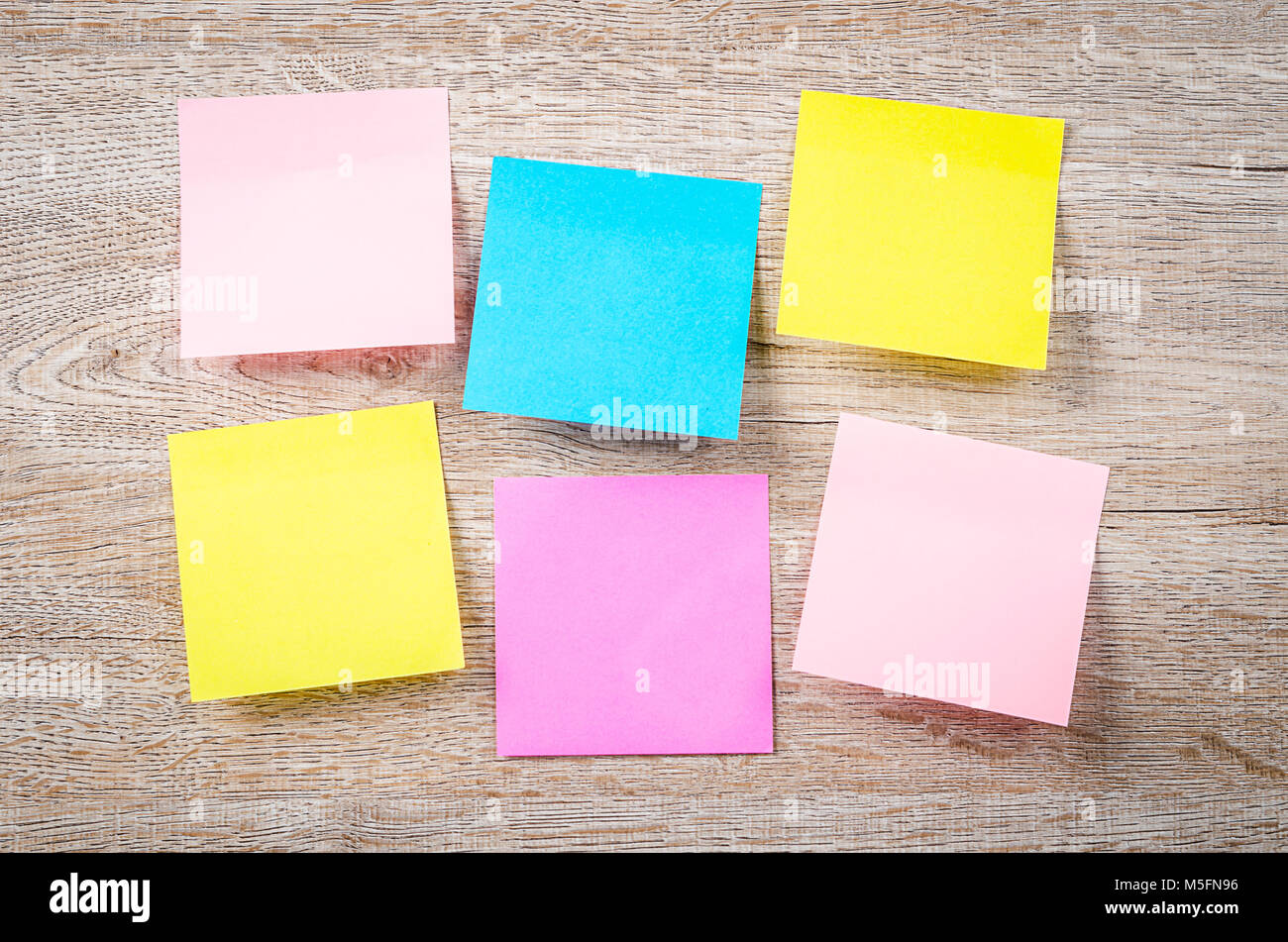 Blank colorful sticky notes on wooden background Stock Photo - Alamy