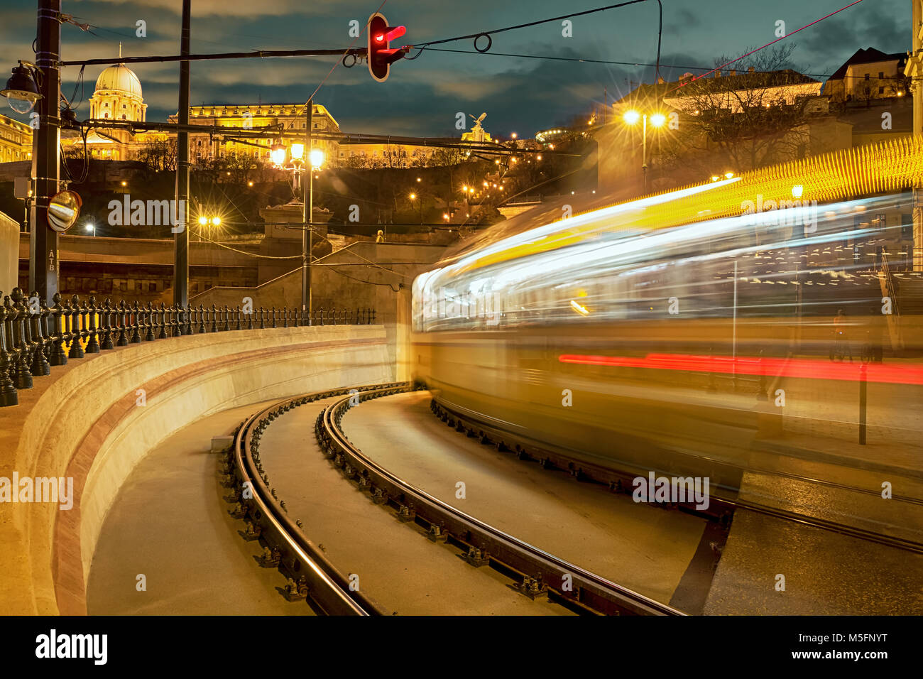 Tramway, luminous trace of moving tram at night Stock Photo - Alamy
