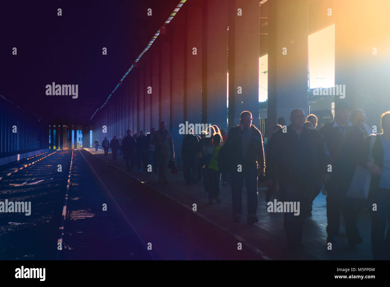 Crowd of people walking on platform in railway station Stock Photo - Alamy