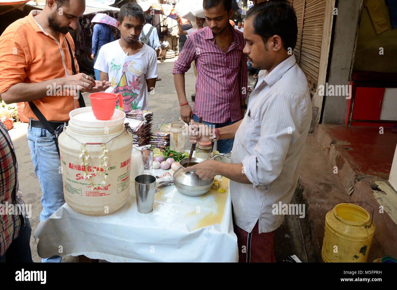 man churning lassi, Kolkata, West Bengal, India, Asia Stock Photo - Alamy