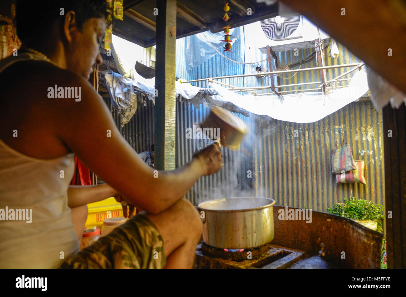 Indian man making tea hi-res stock photography and images - Alamy