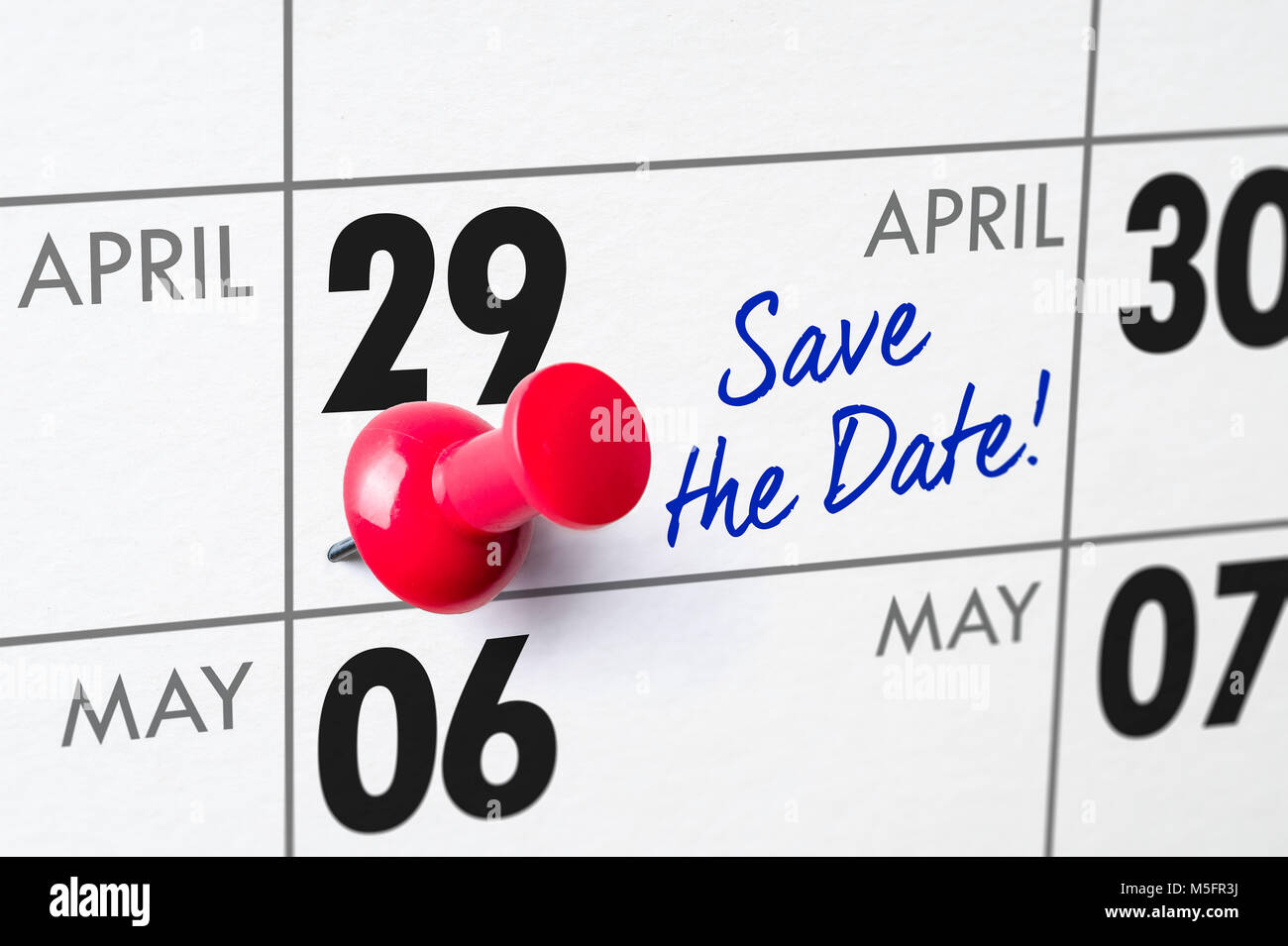 Wall calendar with a red pin - April 29 Stock Photo - Alamy