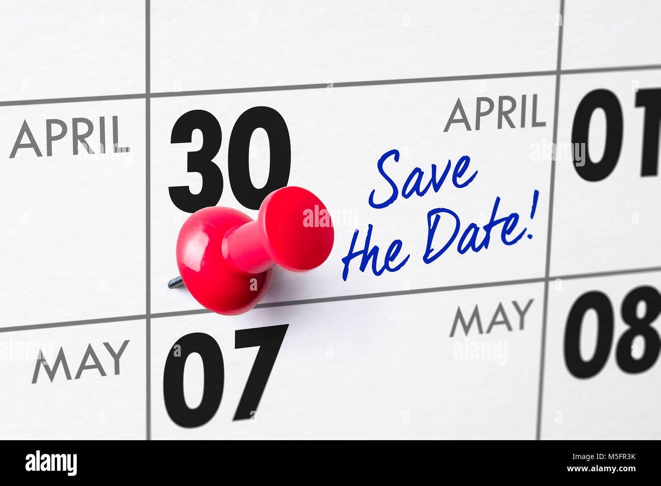Wall calendar with a red pin - April 30 Stock Photo - Alamy