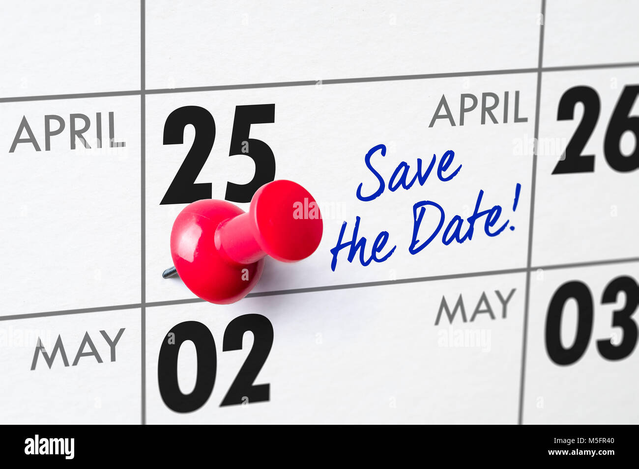 Wall calendar with a red pin - April 25 Stock Photo - Alamy