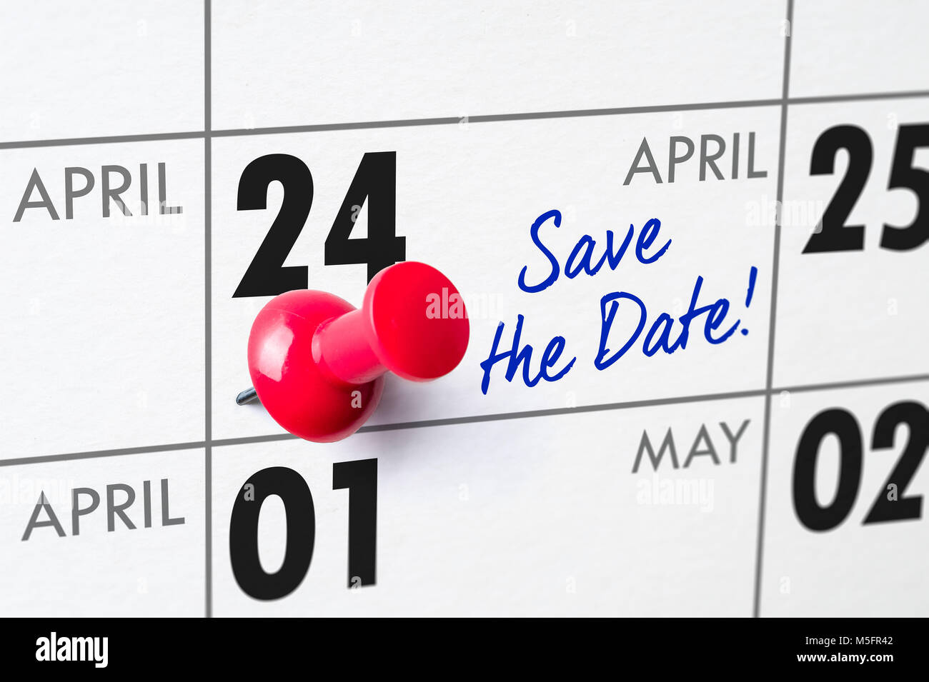 Wall calendar with a red pin - April 24 Stock Photo - Alamy