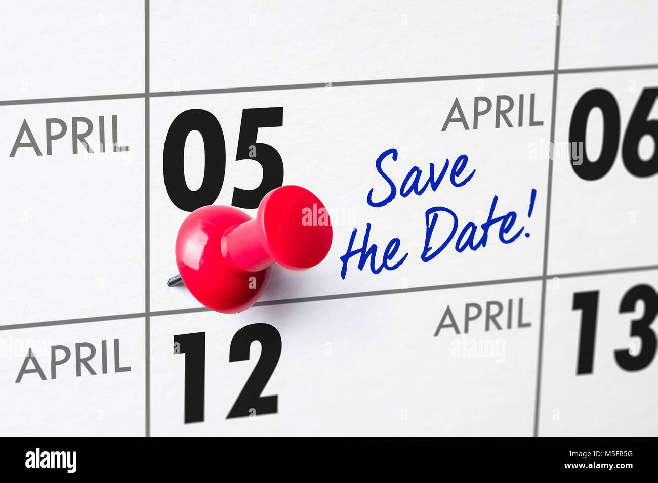 Wall calendar with a red pin - April 05 Stock Photo - Alamy
