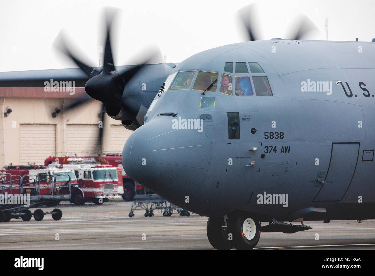 A C-130J Super Hercules taxis on the runway at Yokota Air Base, Japan ...