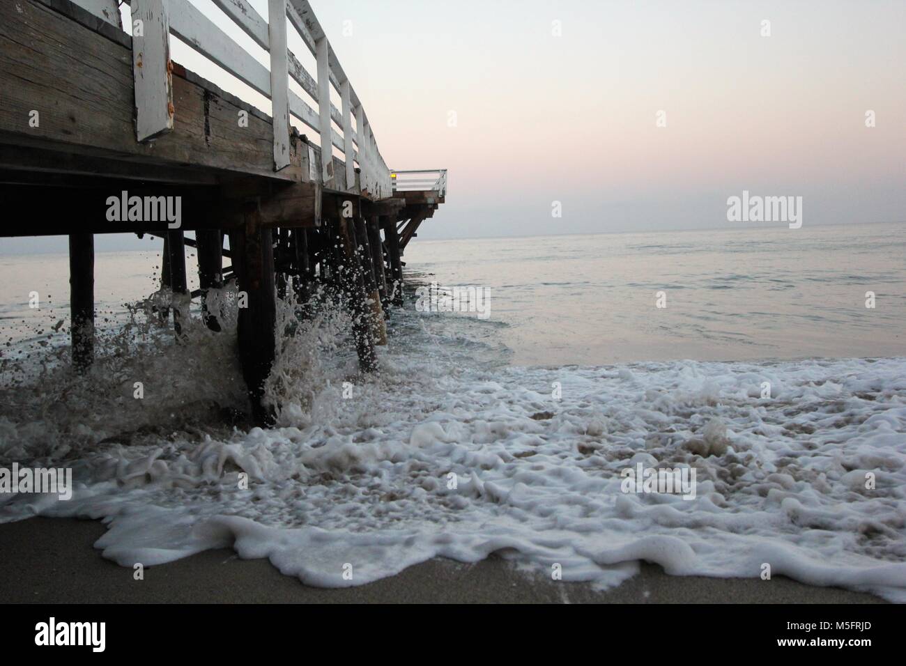Wharf and the ocean waves Stock Photo - Alamy