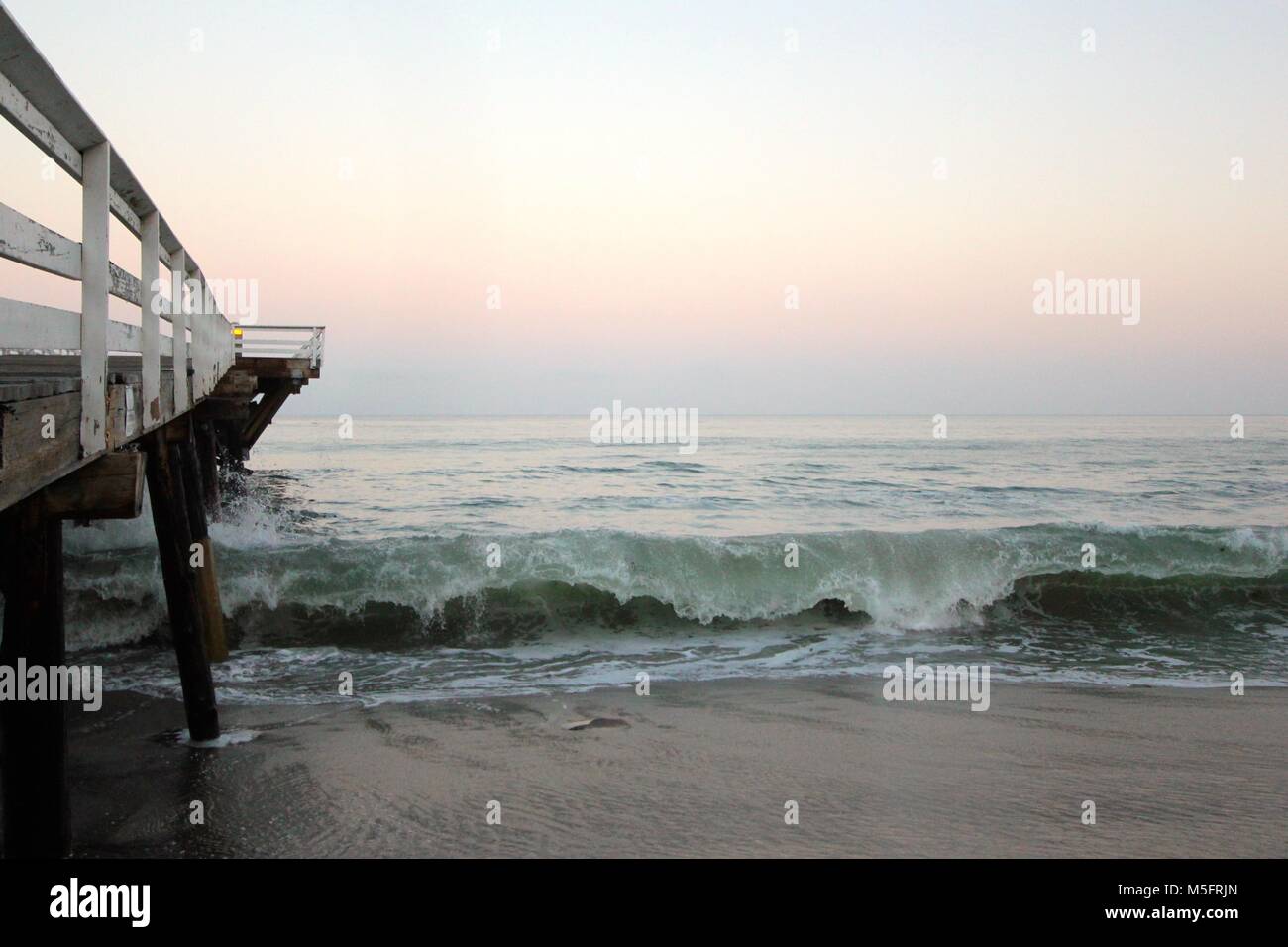 Wharf and the ocean waves Stock Photo - Alamy