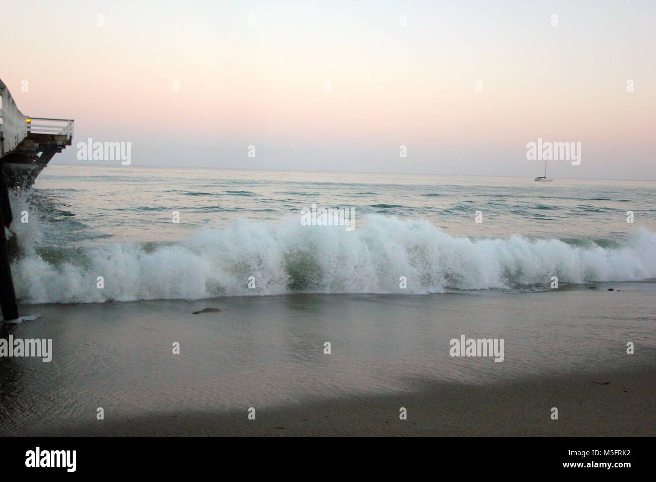 Wharf and the ocean waves Stock Photo - Alamy
