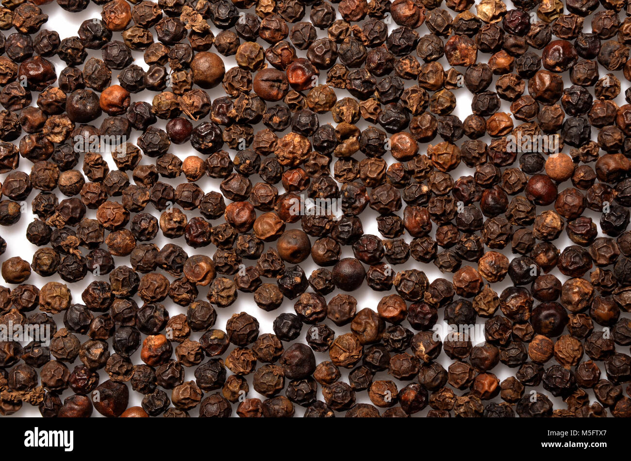 Dried black pepper grains texture, a close up photo of dry black pepper ...