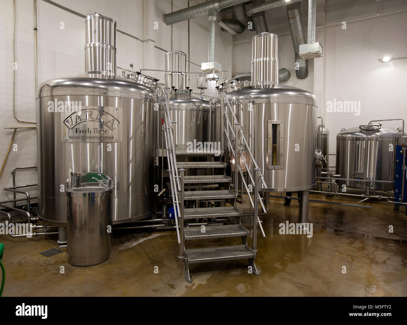 Huge Tanks of white metal, which brewed beer in the brewery, the top ...