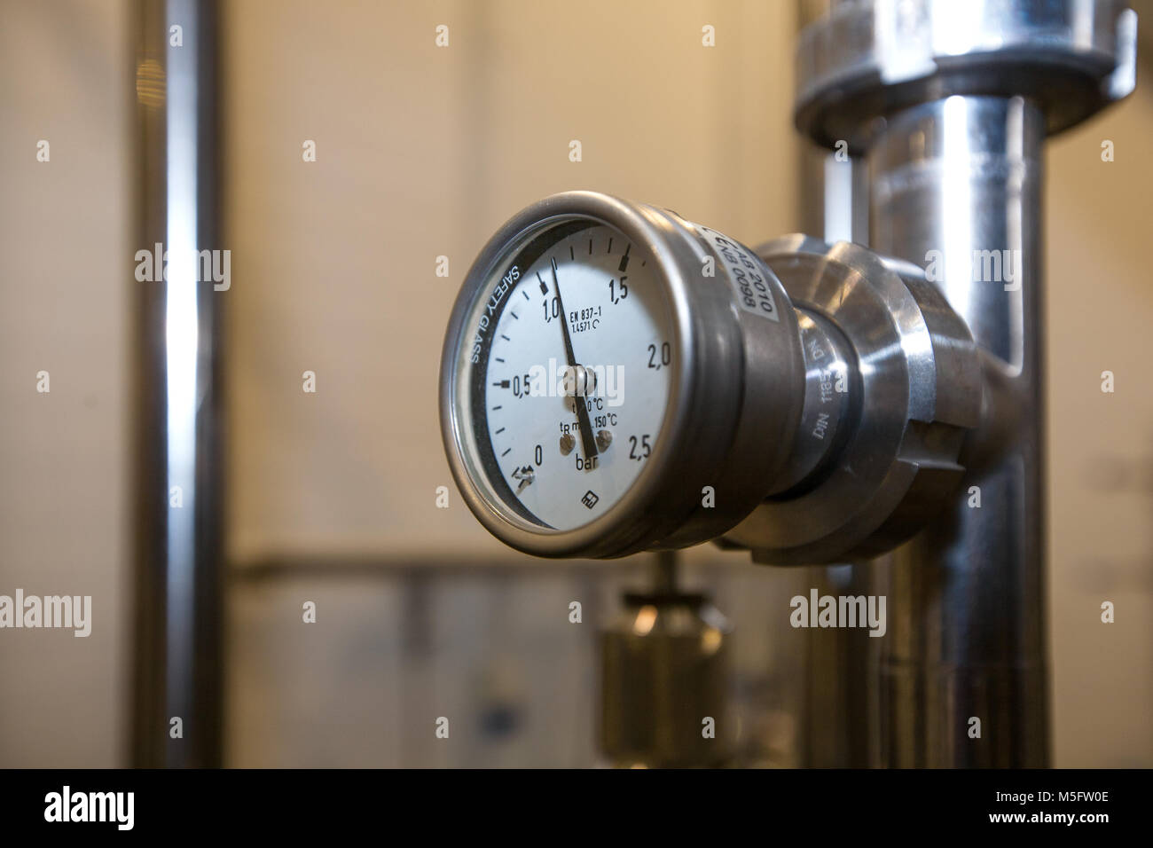 Pressure gauge (manometer) of white metal - brewing equipment. Close-up ...