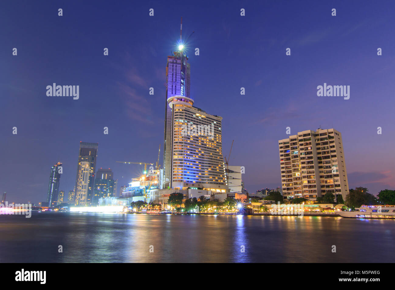 high building at the river in sunset time Stock Photo - Alamy