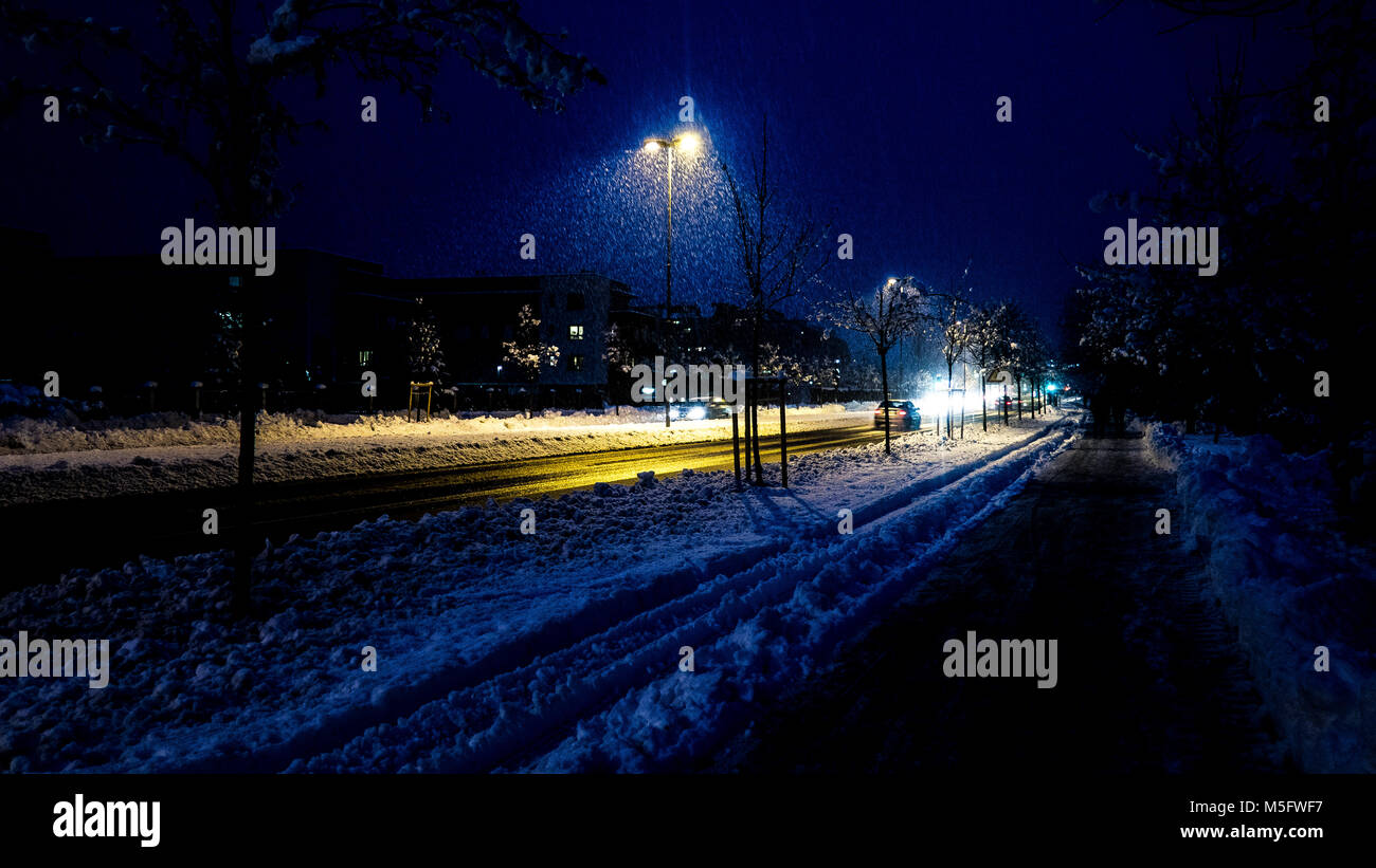 Snowy night road Stock Photo - Alamy