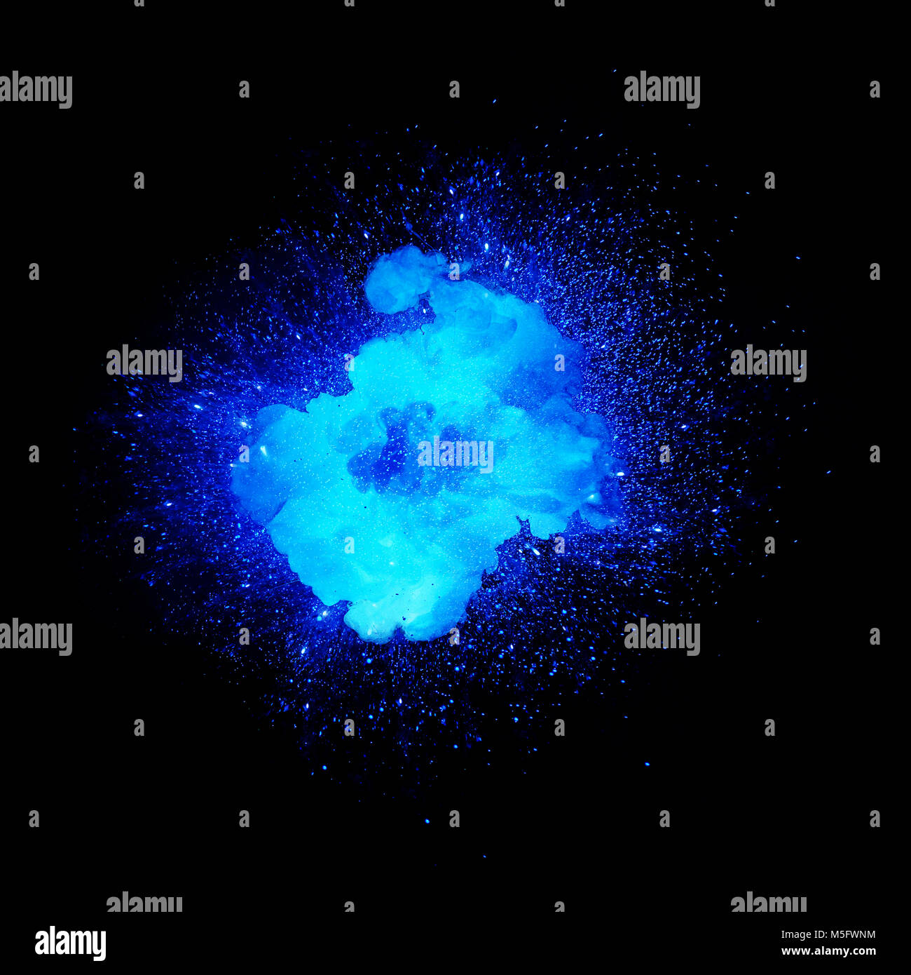 Blue fire round explosion with sparks and smoke isolated on black ...