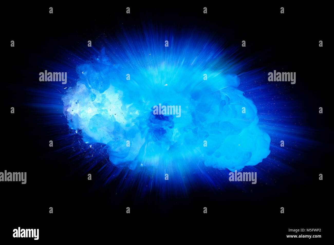 Blue fire explosion with sparks and smoke isolated on black background ...