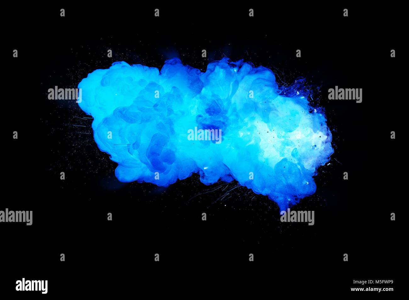 Blue fire explosion with sparks and smoke isolated on black background ...