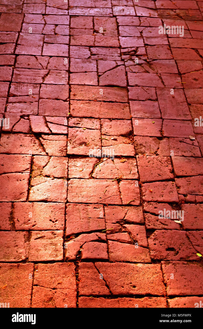 Uneven brick pavement, a select focus on an old uneven pavement that ...