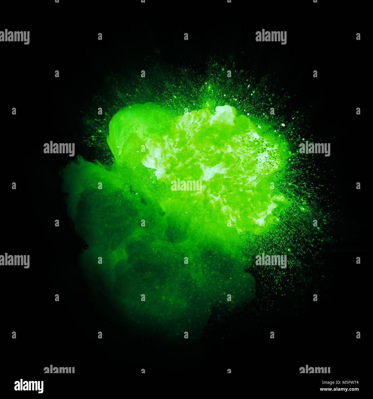 Green fire explosion with sparks and smoke isolated on black background ...