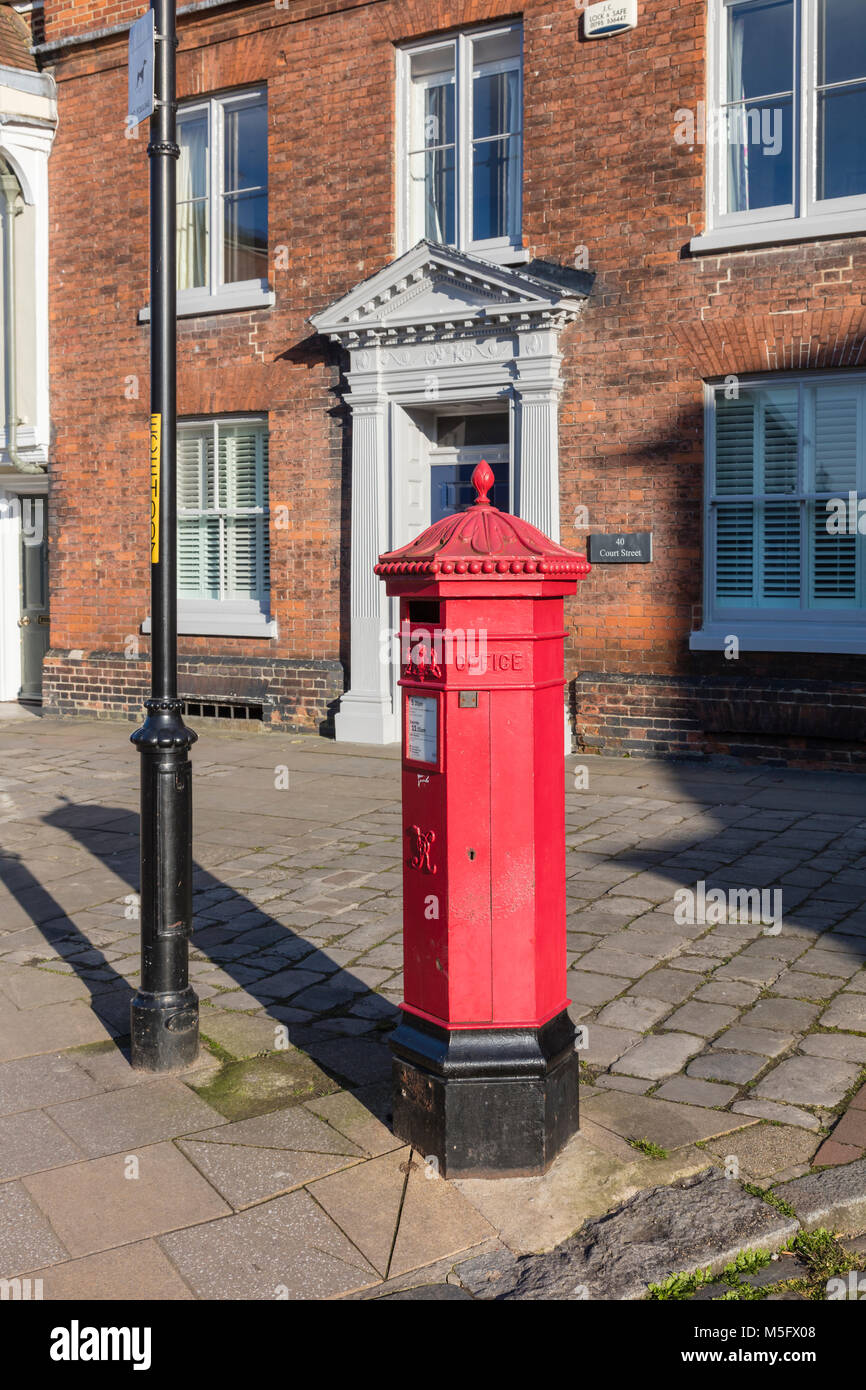 Ornate red Queen Victoria five sided post box in the centre of ...