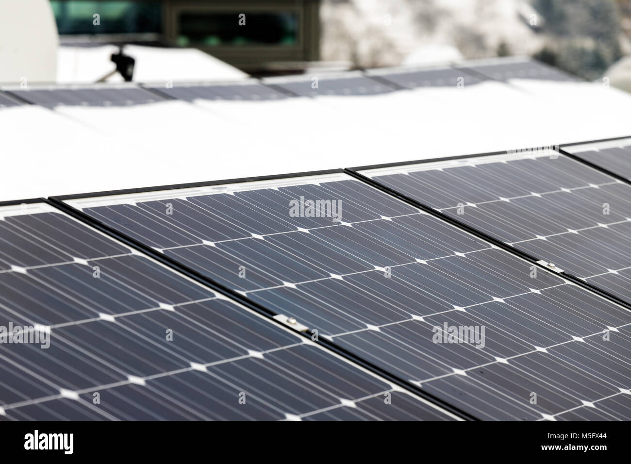 Photovoltaic panels on the roof cover with snow, in the winter Stock ...