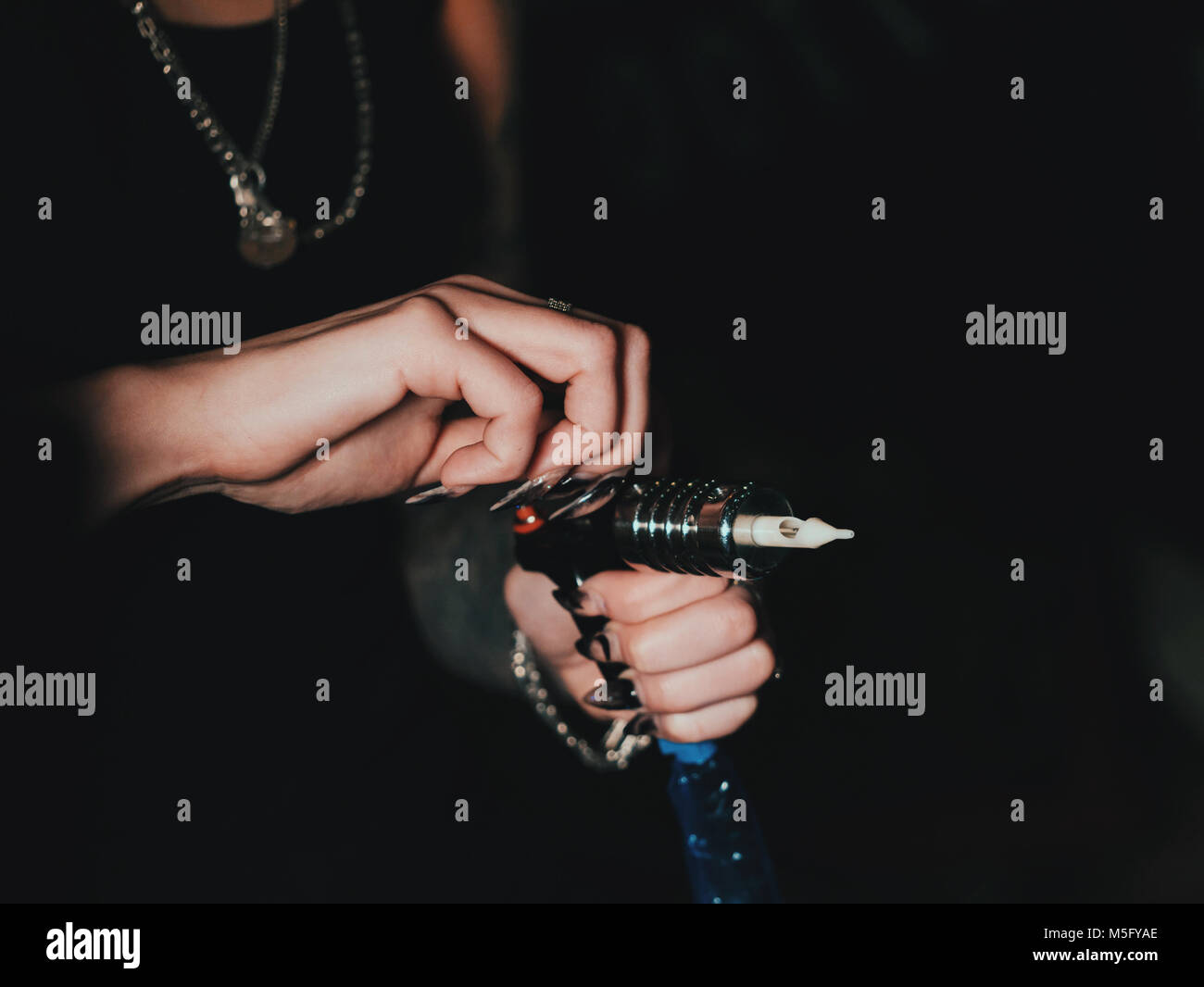 Female tattoo artist prepares machine hi-res stock photography and ...