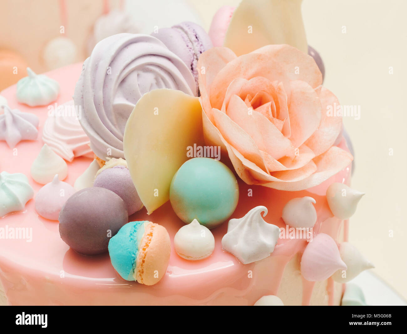 Modern French mousse cake with pink mirror glaze decorated with ...
