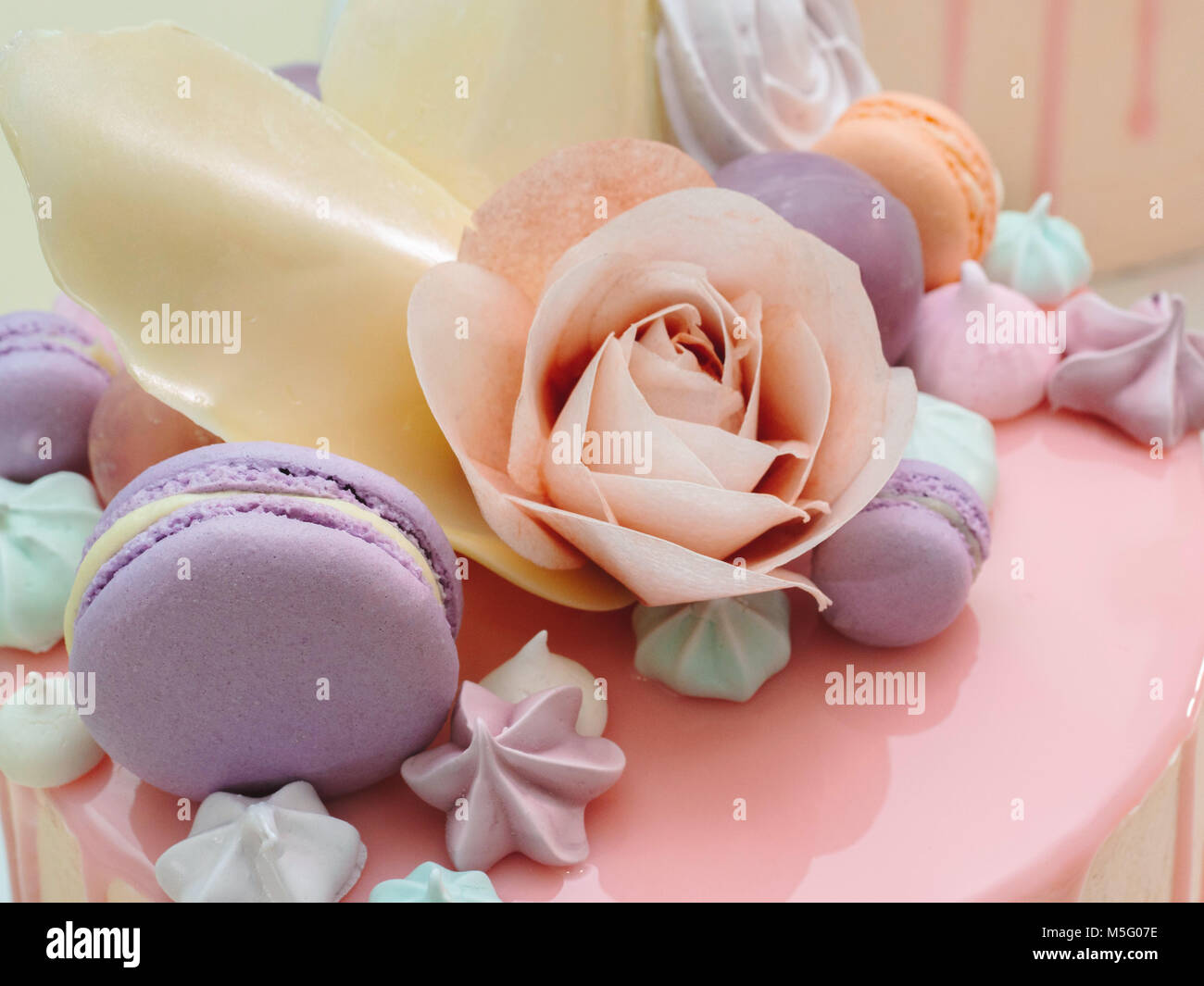 Modern French mousse cake with pink mirror glaze decorated with ...