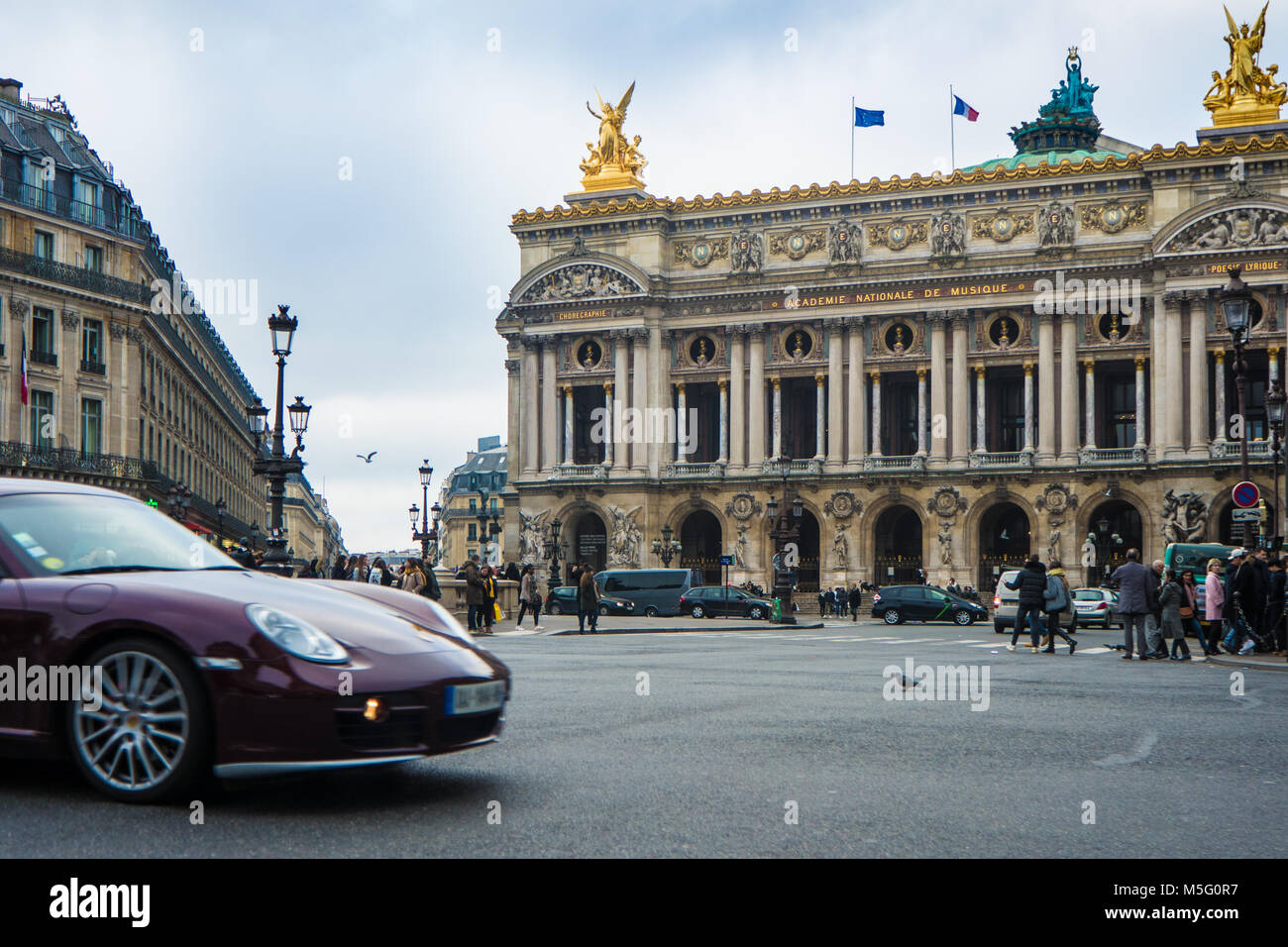 Luxury car in front of the French Opera Garnier in Paris Stock Photo ...