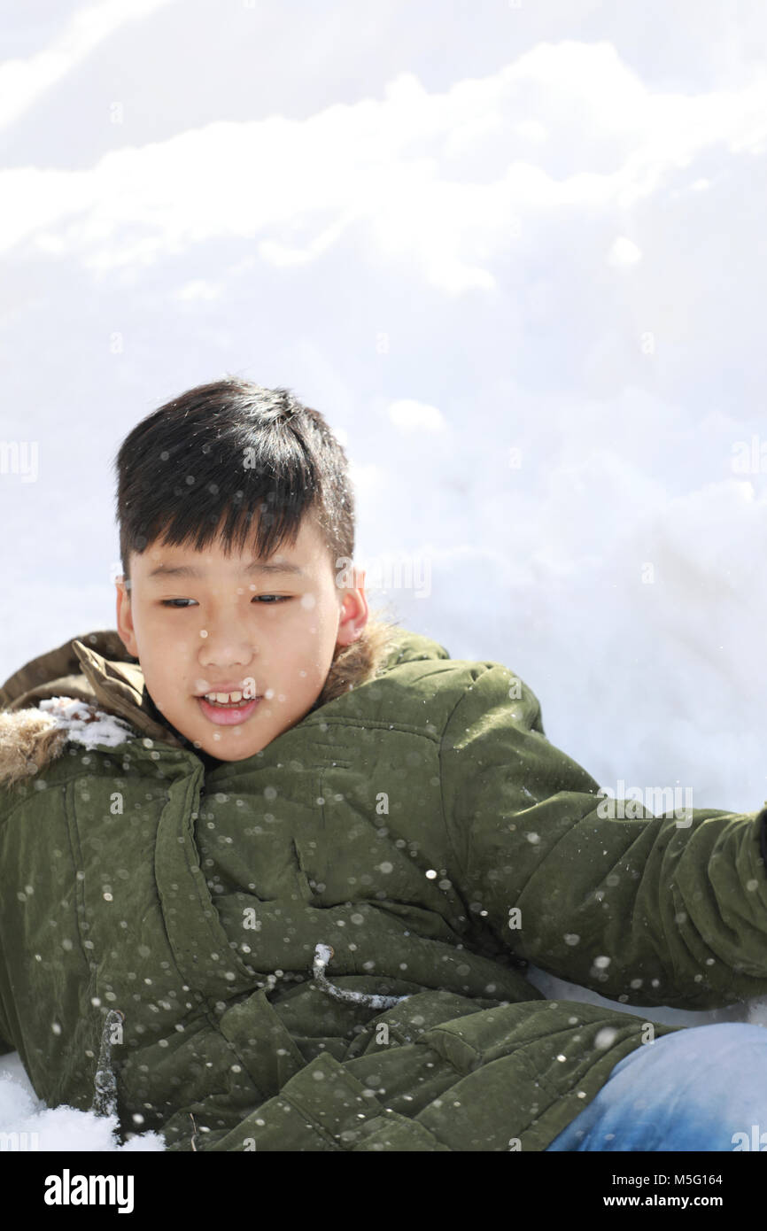 Boy Lay In Snow High Resolution Stock Photography and Images - Alamy