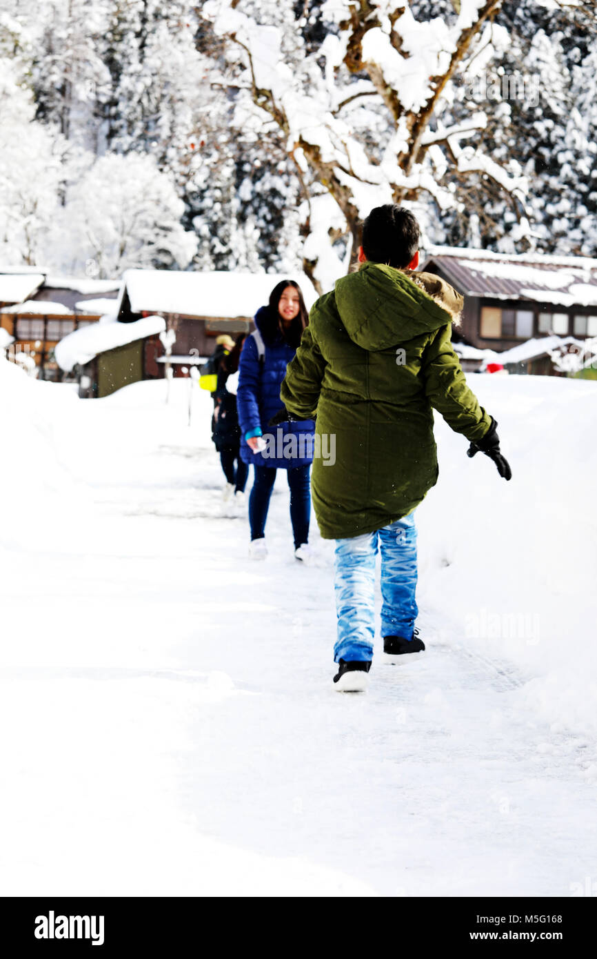 boy lay down on the snow and enjoy snow in the winter Stock Photo - Alamy