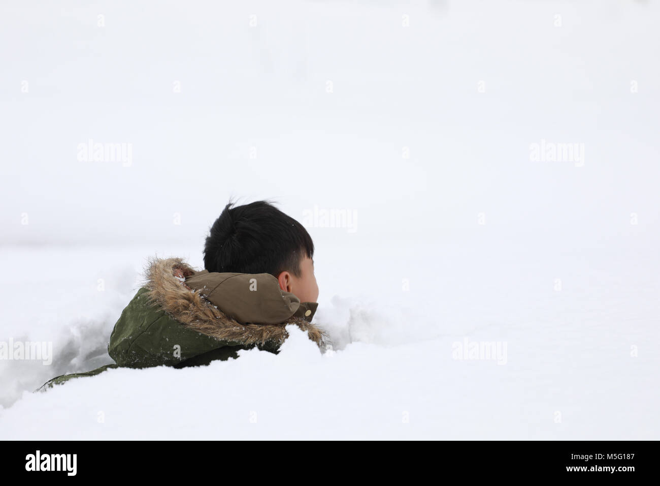 Boy Lay In Snow High Resolution Stock Photography and Images - Alamy