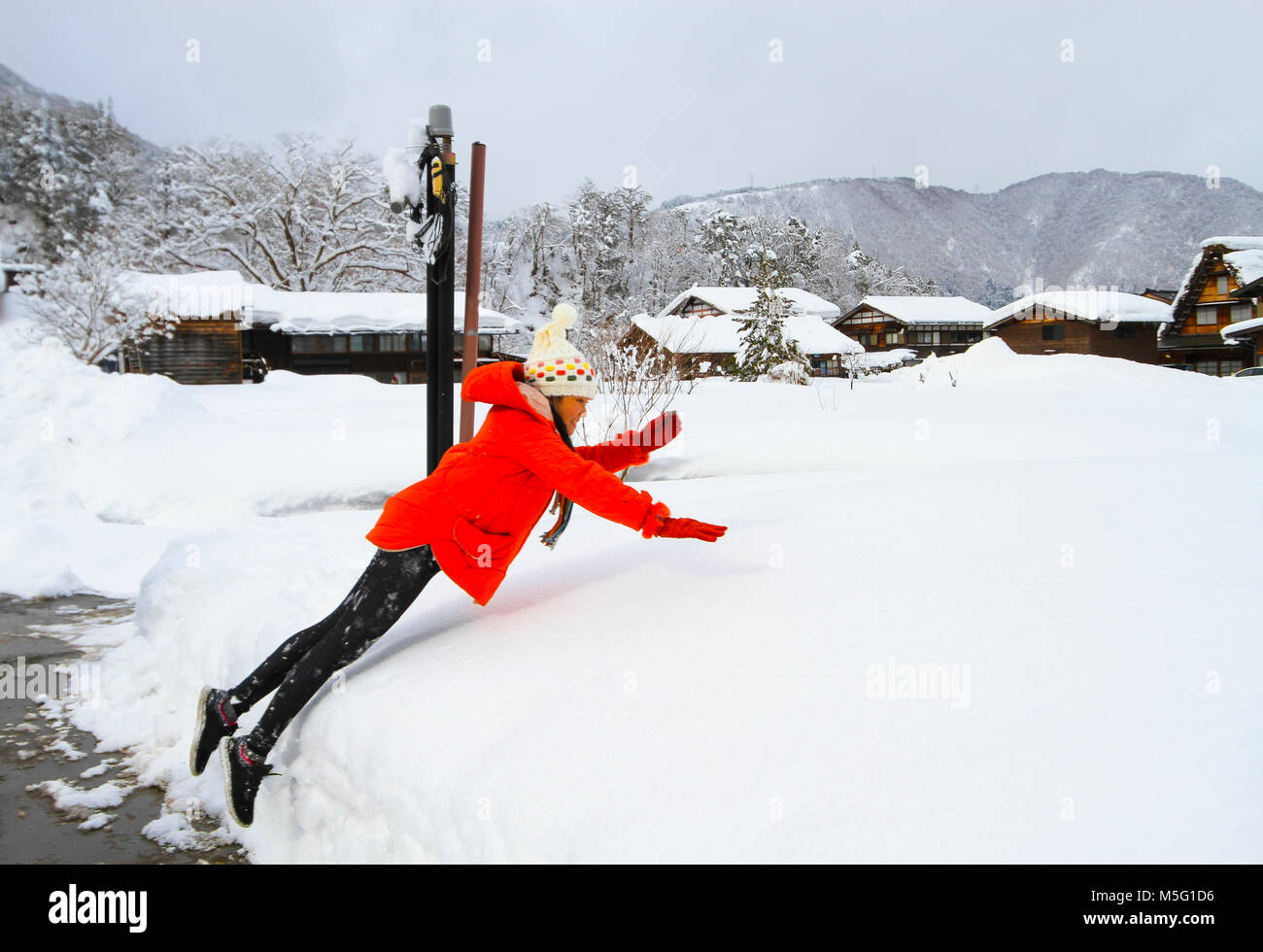 woman lay down on the snow and enjoy snow in the winter Stock Photo - Alamy