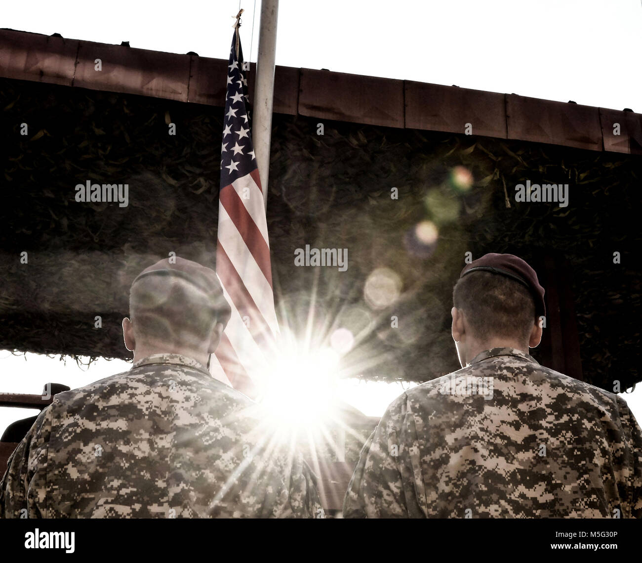 American Soldiers and US Flag with sunlight Stock Photo - Alamy