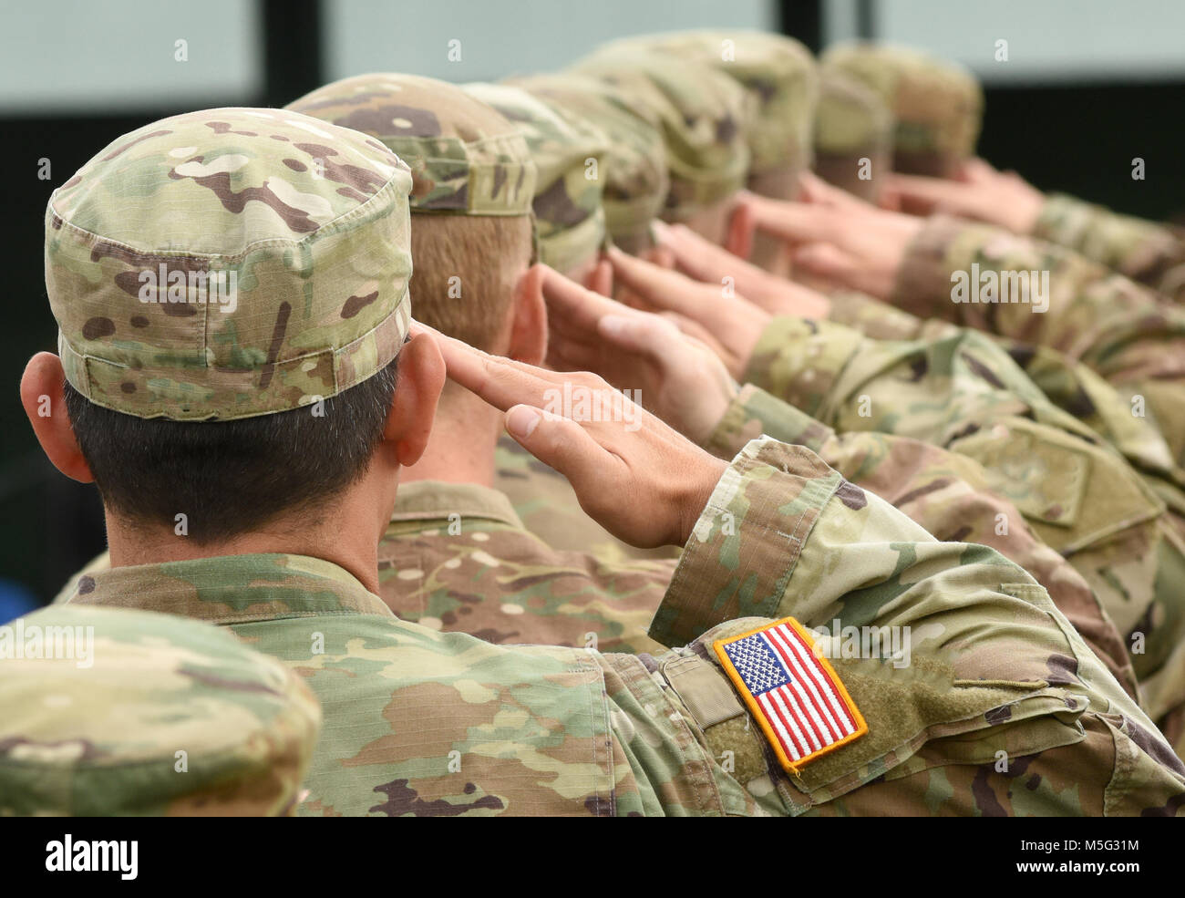 US soldiers giving salute Stock Photo - Alamy
