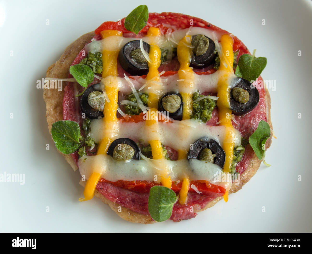 A beautiful, colorful mini-pizza on a white background Stock Photo - Alamy