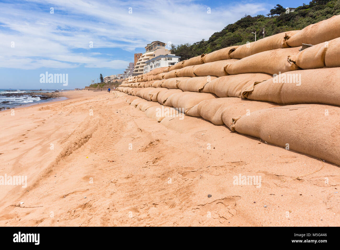 Construction excavators machines on beach water line coastline building ...