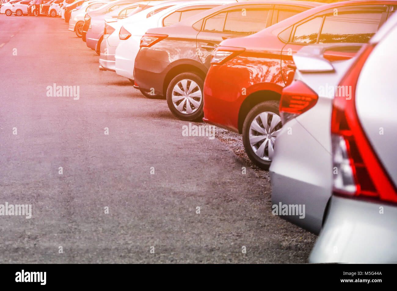Car parked row on road,Cars parking in line on street Stock Photo - Alamy