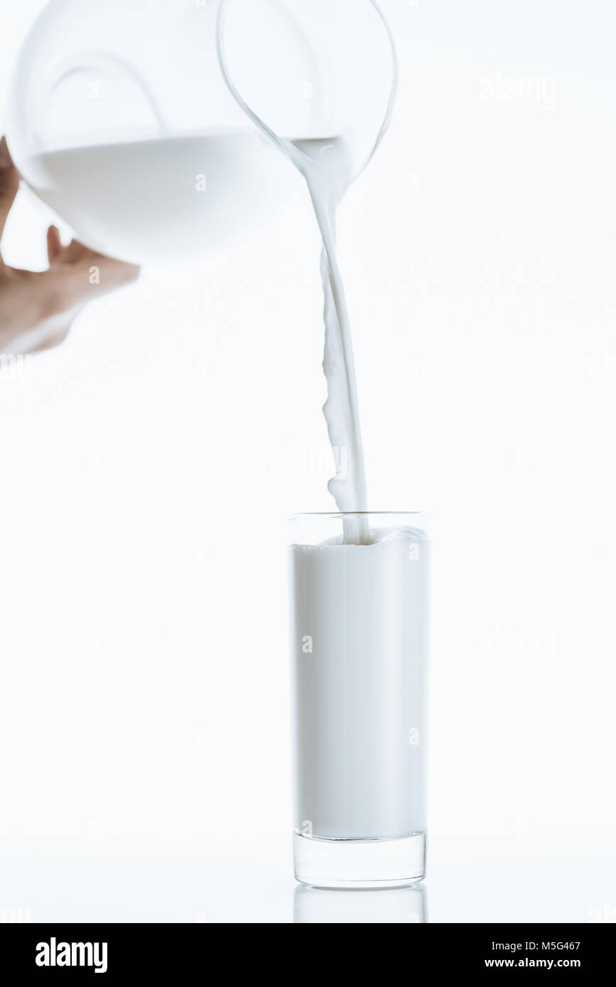 milk pouring from milk jar Stock Photo - Alamy