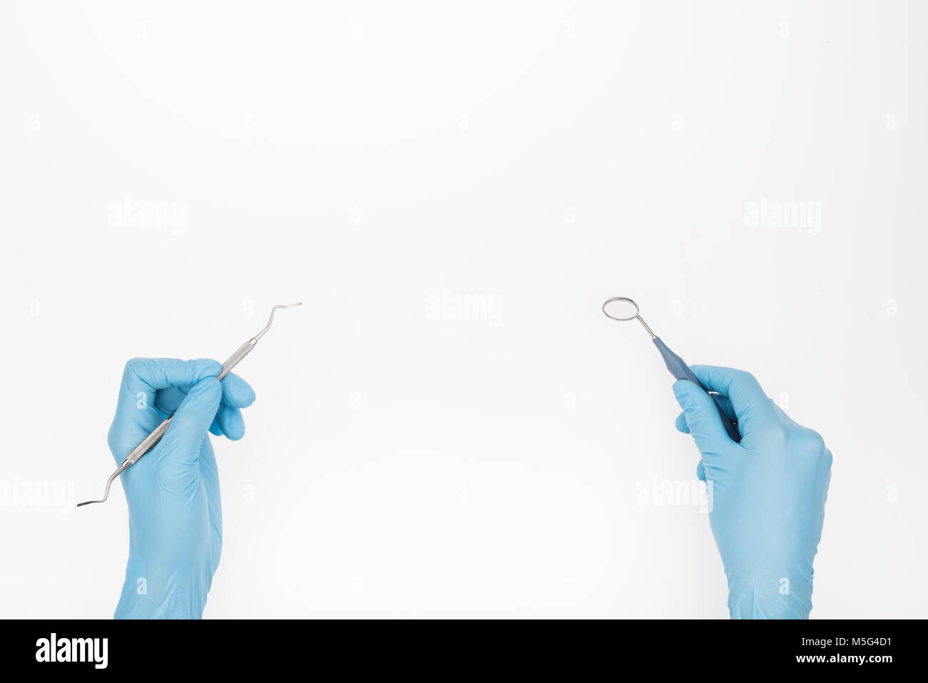 professional dentist with probe and mirror Stock Photo - Alamy