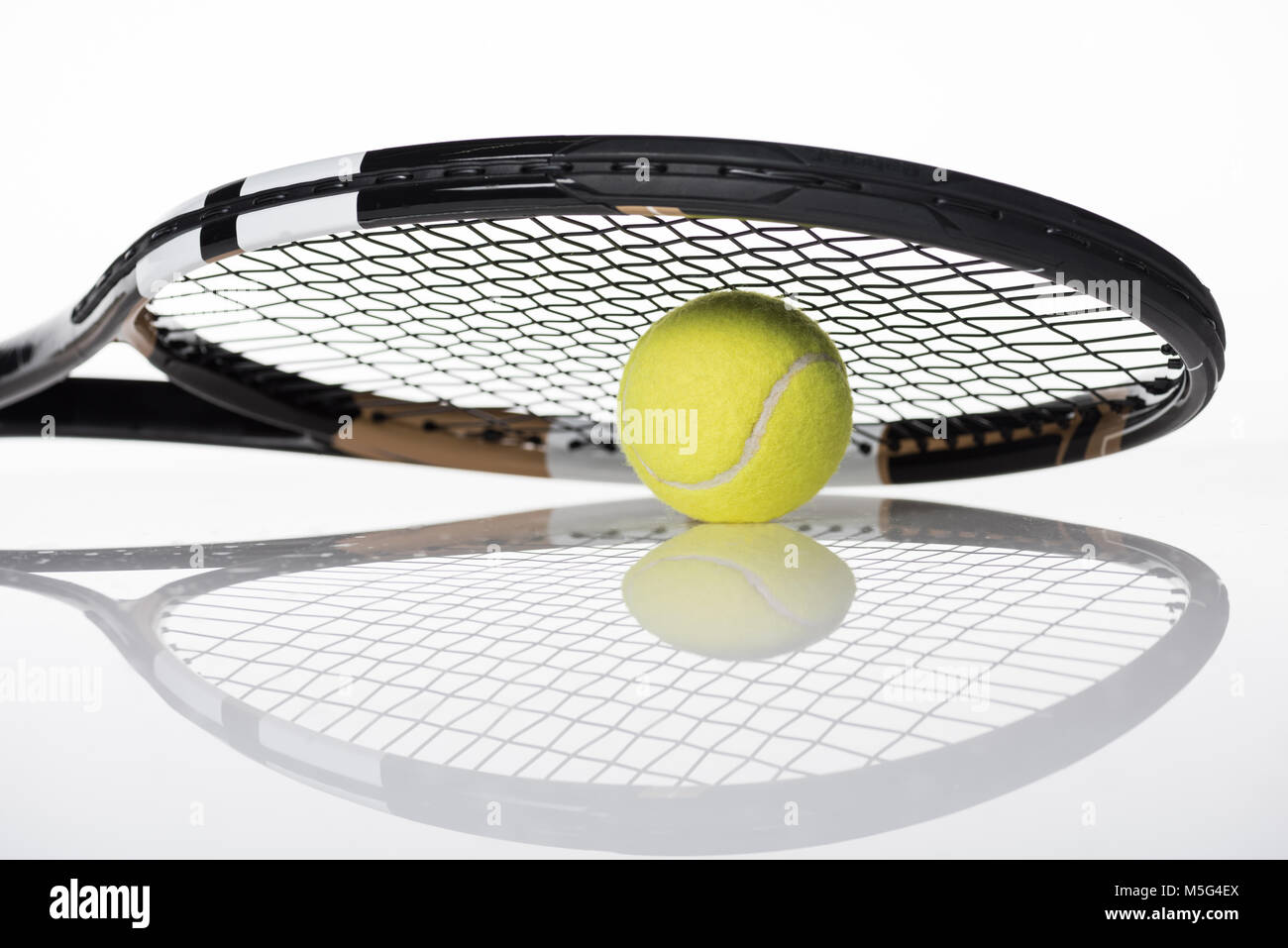 Tennis ball and racket Stock Photo - Alamy