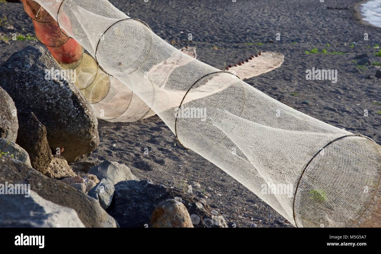 Fishing net on a sand beach Stock Photo - Alamy