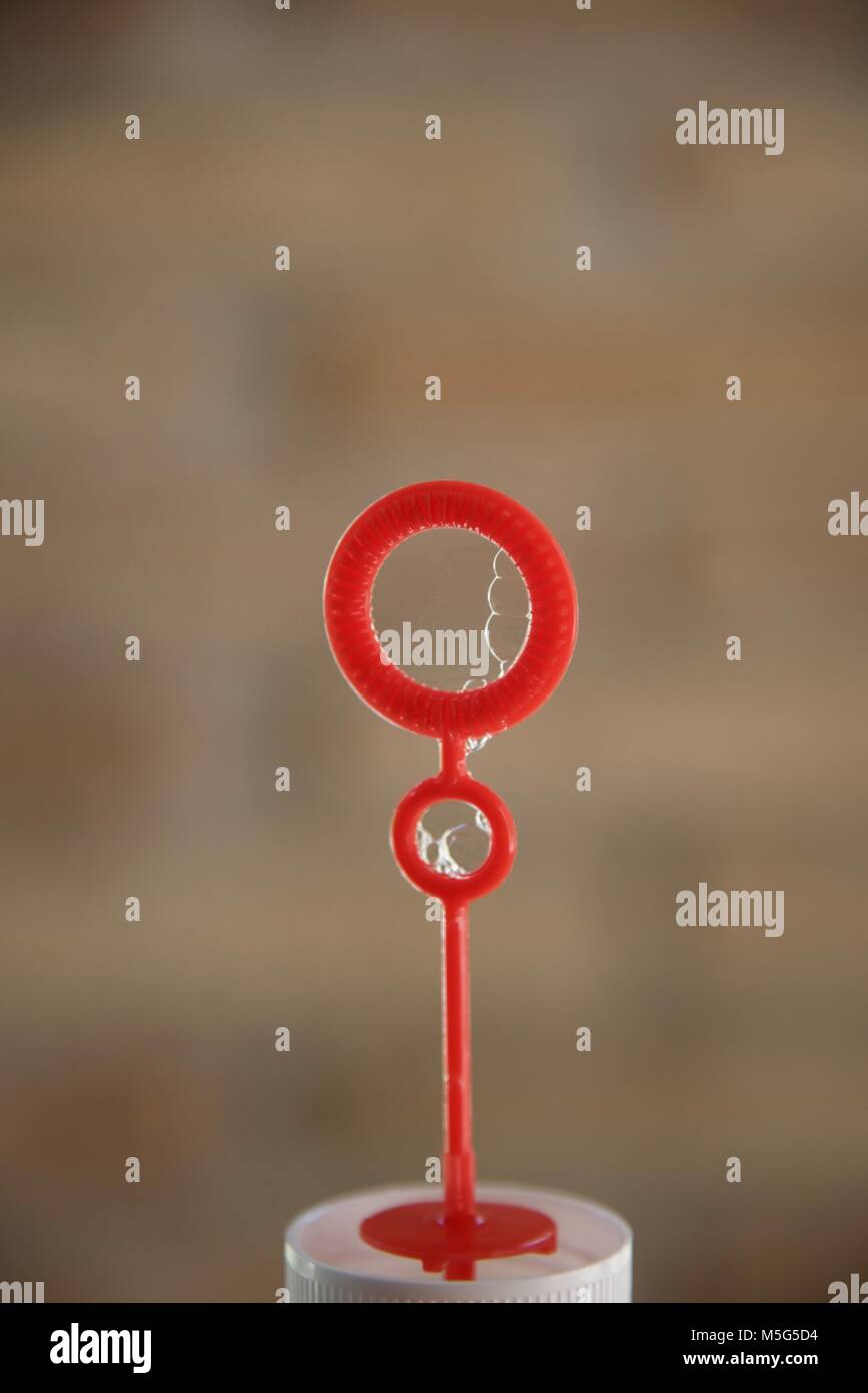Soap bubble red stick Stock Photo - Alamy