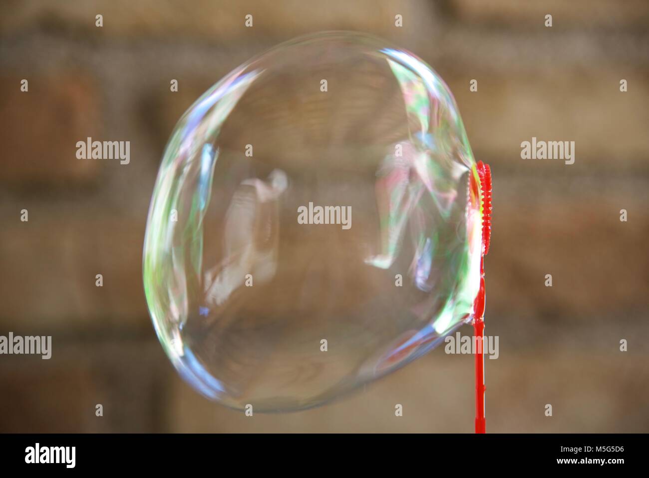 Soap bubble red stick Stock Photo - Alamy